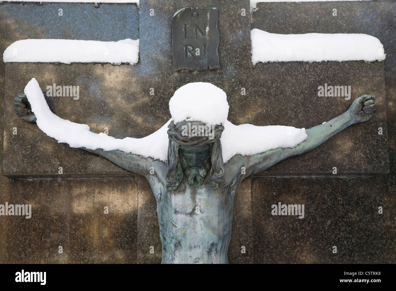 Germany, Cologne, Snow covered Crucifix on grave, close-up Stock Photo ...