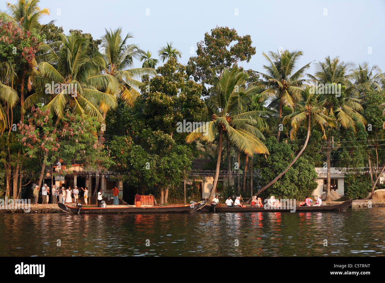 India, Kerala, Alappuzha, People in boat at backwaters of alleppey ...