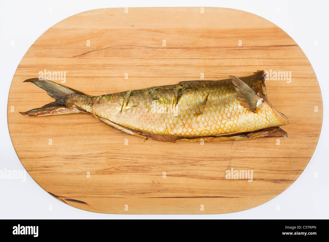 Smoked Salmon (Arripis trutta) on chopping board, elevated view Stock ...