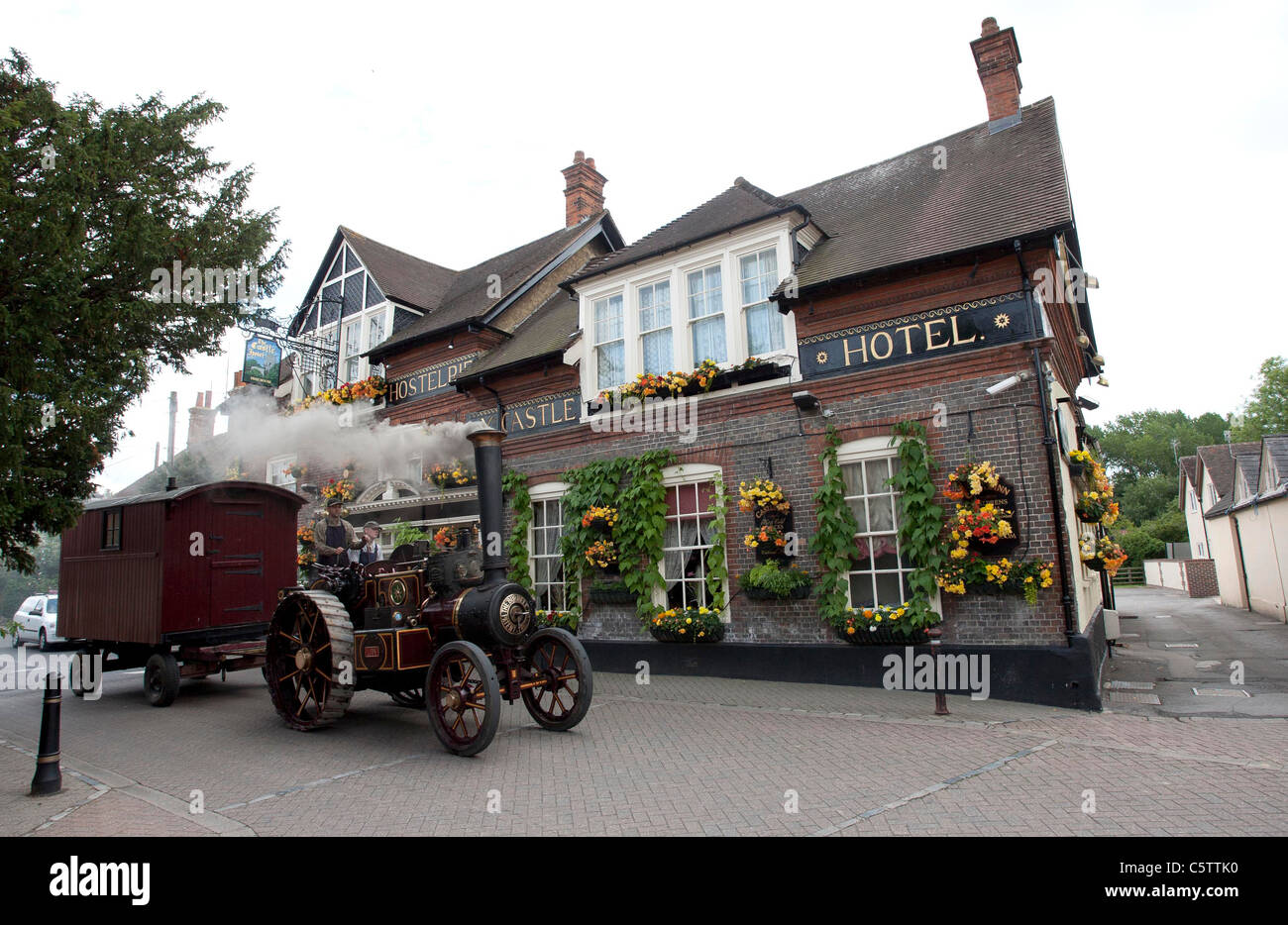 A steam powered Burrell Tractor passes The Castle Inn Bramber. Picture ...