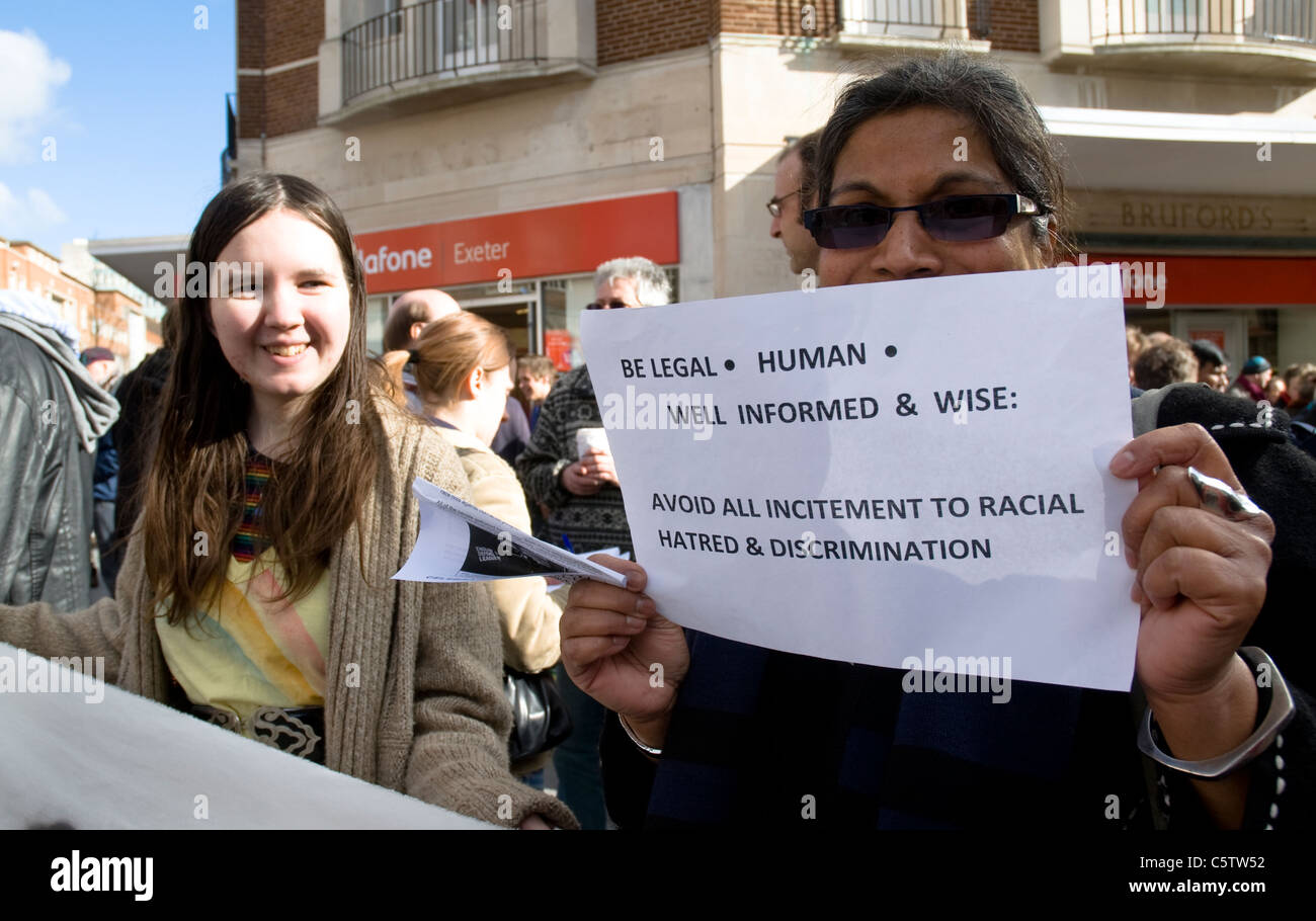 Two women hold signs for Unity and Love at the Celebration of Diversity ...