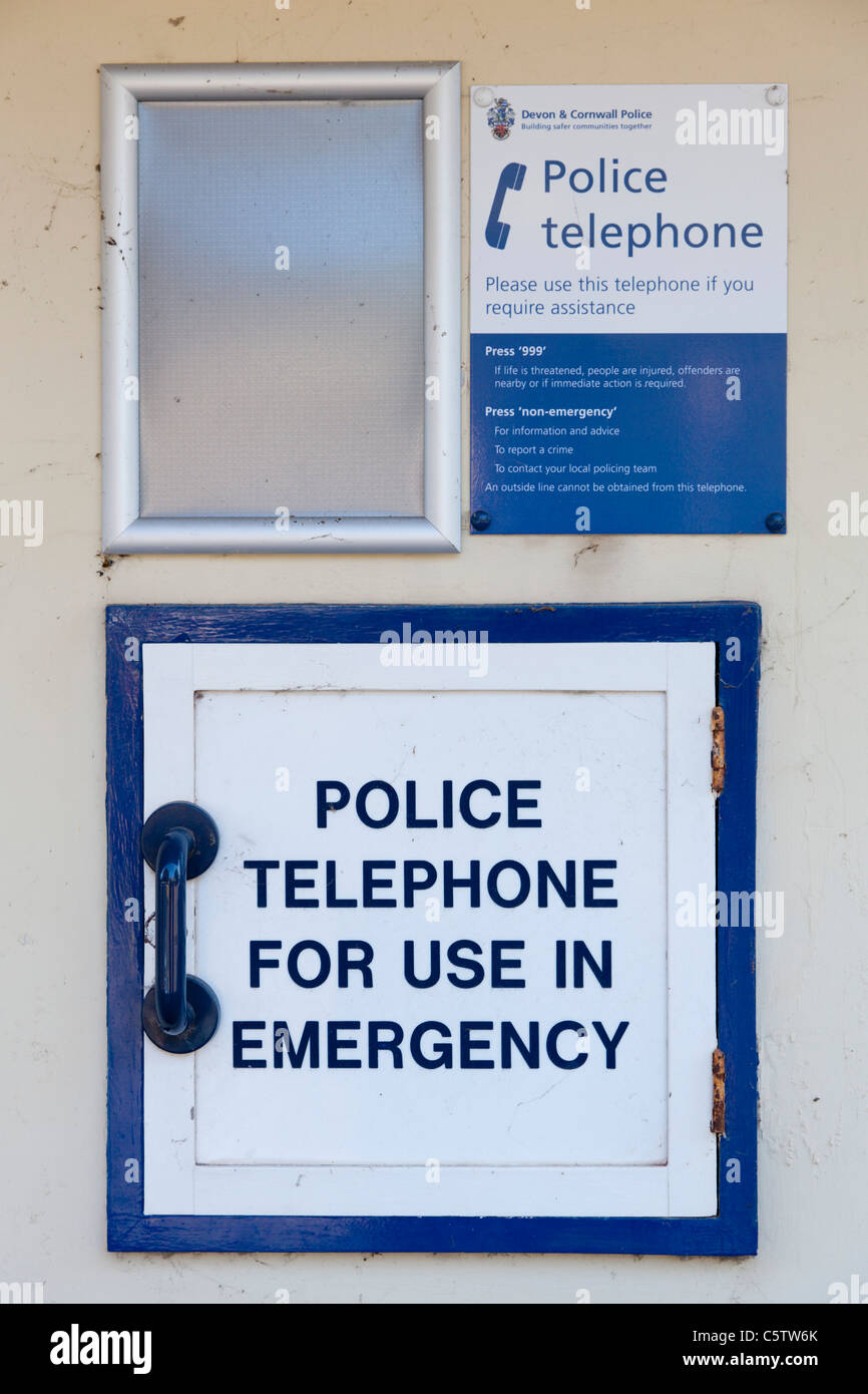 Police emergency telephone box in wall of closed police staion Budleigh ...