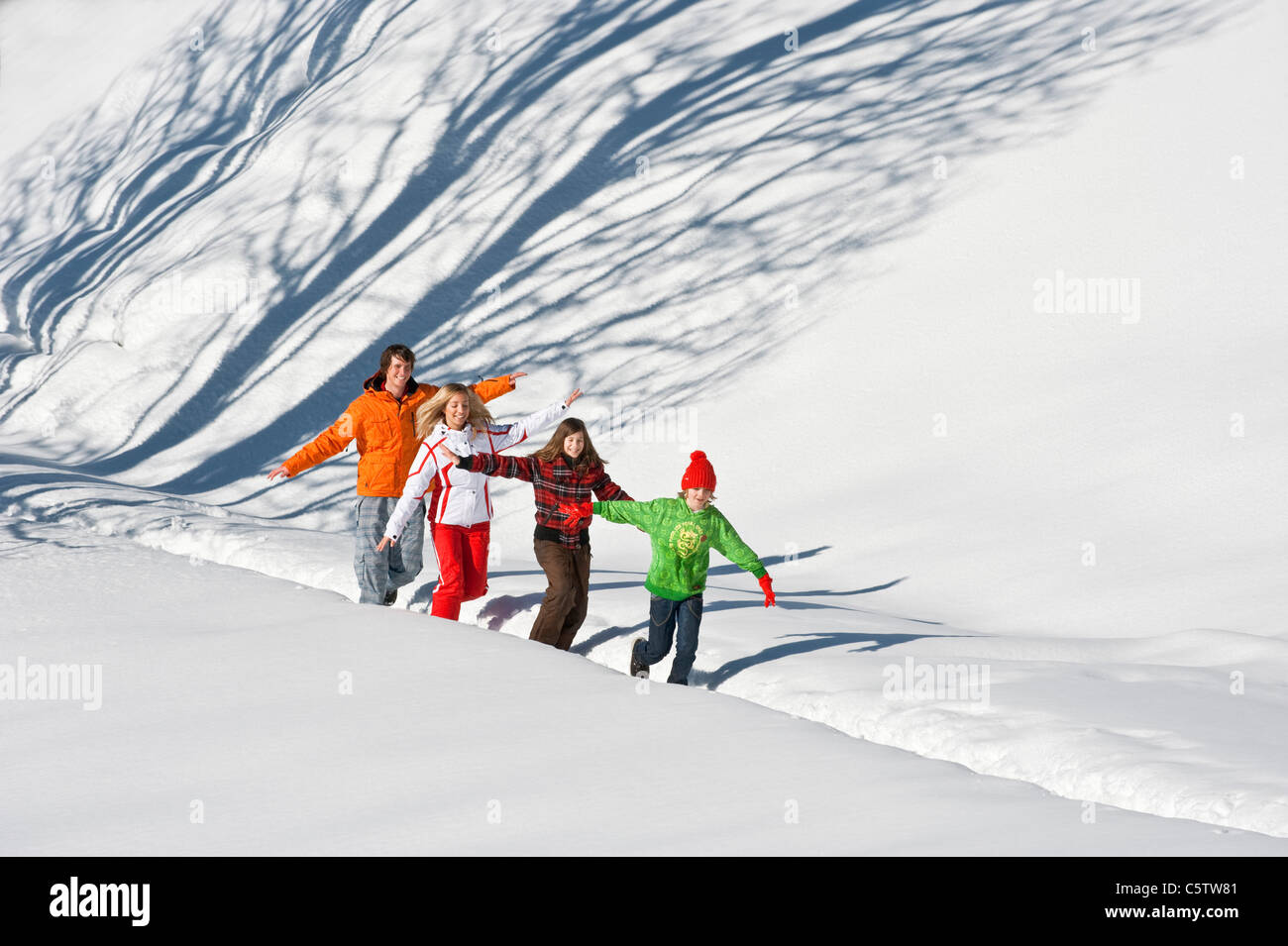 Austria, Salzburger Land, Altenmarkt, Family walking in snow Stock ...