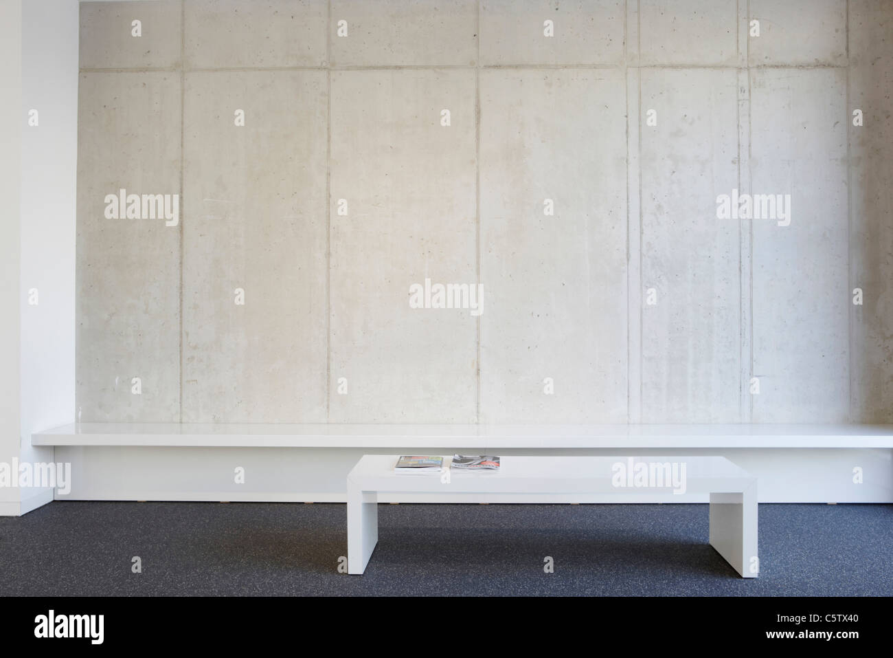 Bench and table in modern office lobby Stock Photo - Alamy