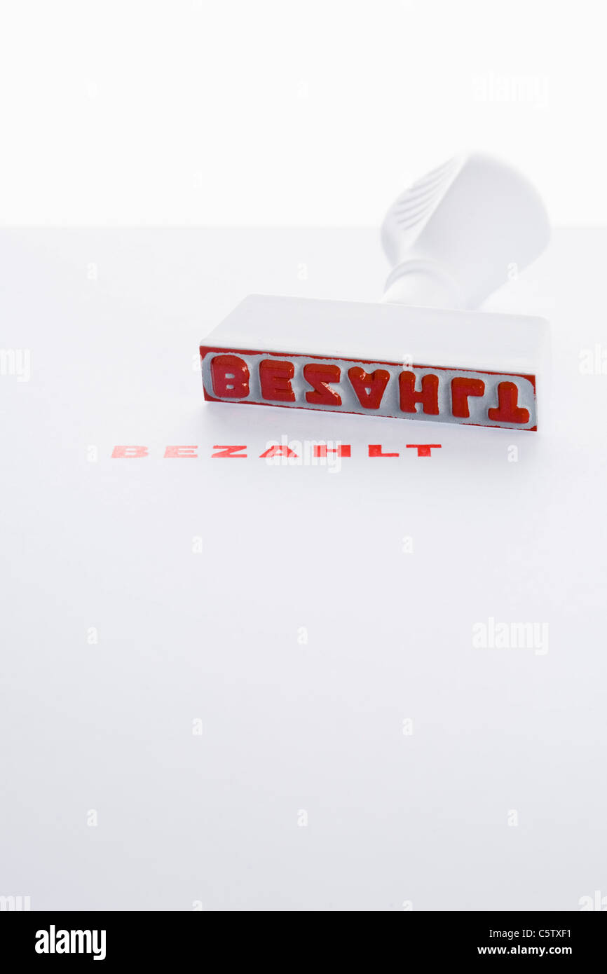 "Paid" rubber stamp, close-up Stock Photo - Alamy