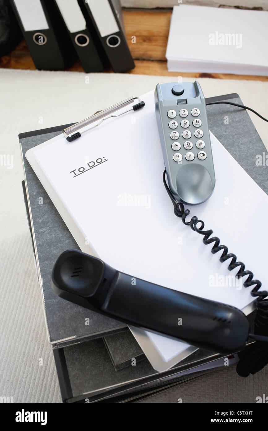Workplace, Telephone, clipboard and folders Stock Photo - Alamy