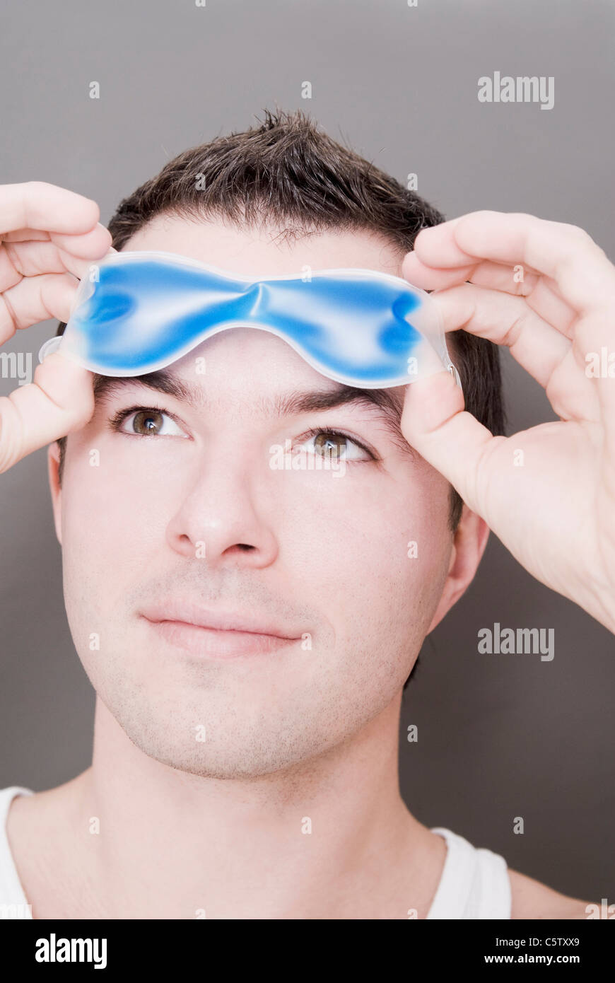 Man wearing eye mask, portrait, close-up Stock Photo - Alamy