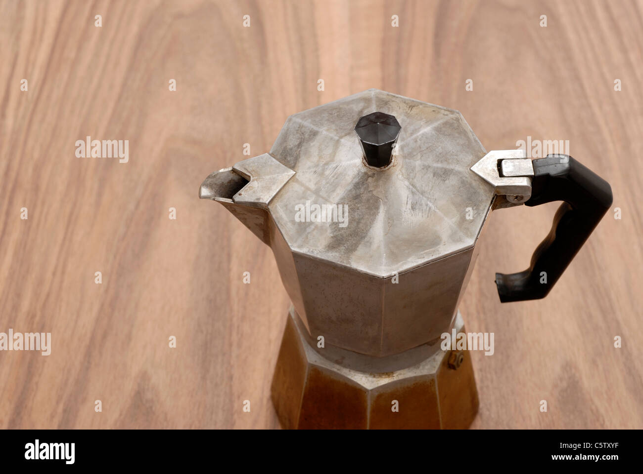 Espresso maker on wooden table, elevated view Stock Photo - Alamy