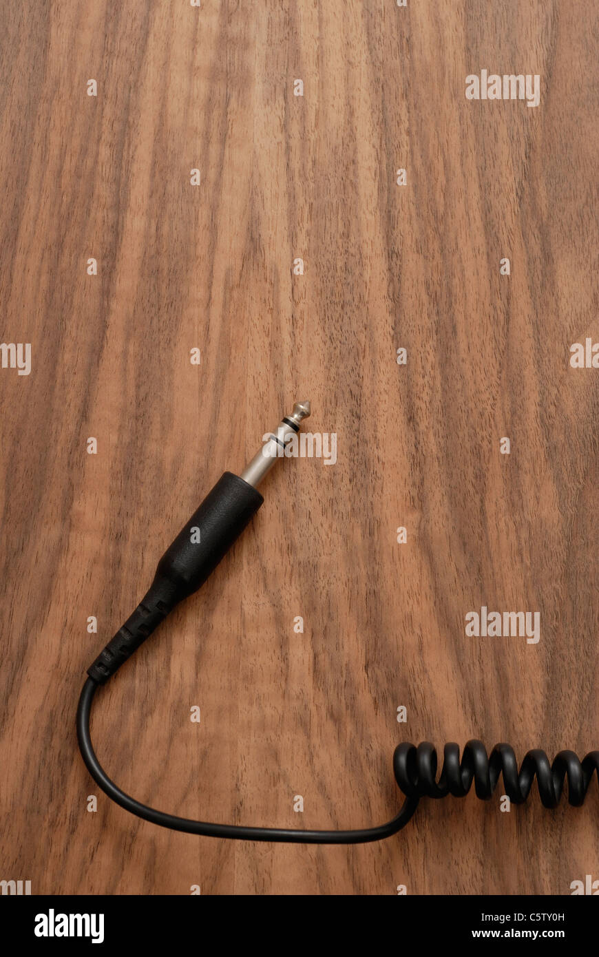 Jack plug on wooden table, elevated view Stock Photo - Alamy