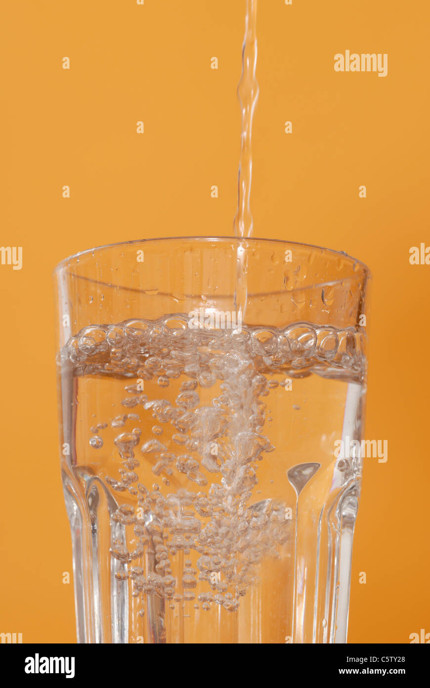 Water being poured into glass, close up Stock Photo - Alamy