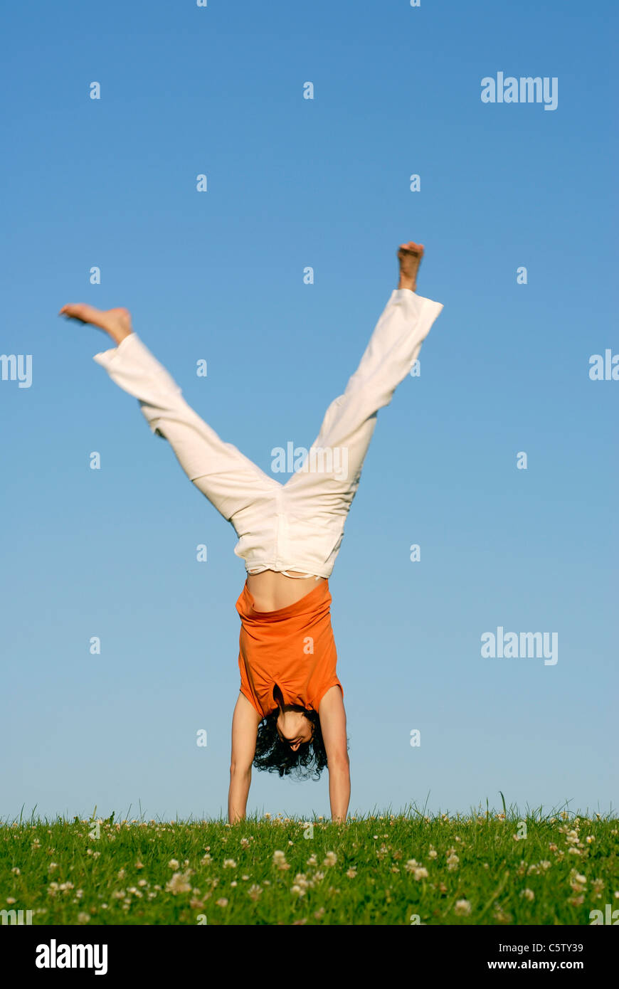 Handstand on meadow hi-res stock photography and images - Alamy