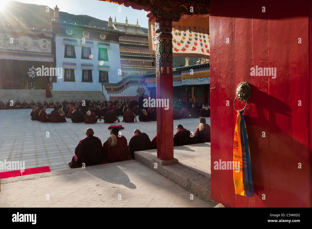 Yellow Hat Sect Tibetan Buddhist monks gather for evening prayers at ...