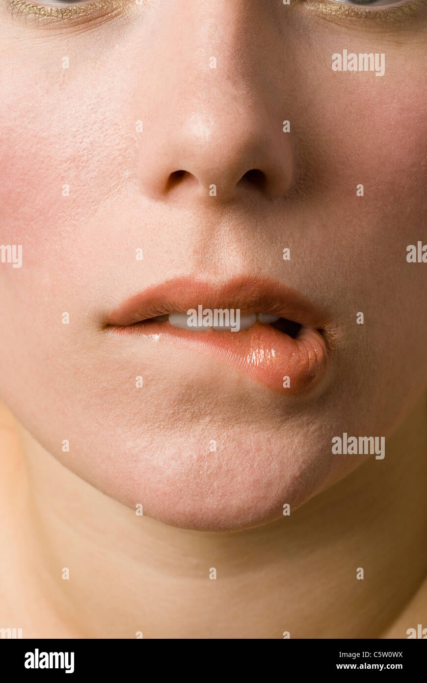 Woman biting lip lips hi-res stock photography and images - Alamy