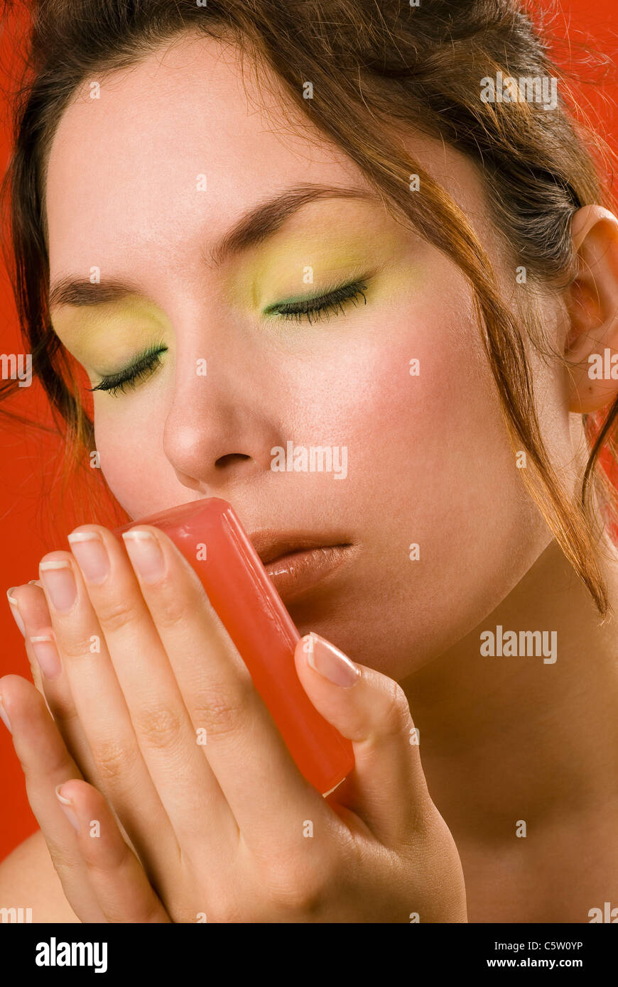 Young woman holding cake of soap, eyes closed, close up Stock Photo - Alamy