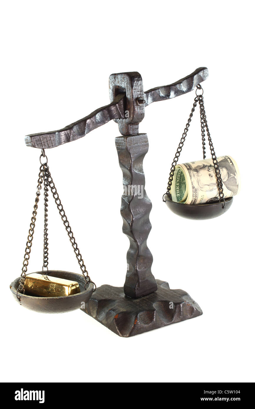Beam balance with gold bars and dollars on a white background Stock ...