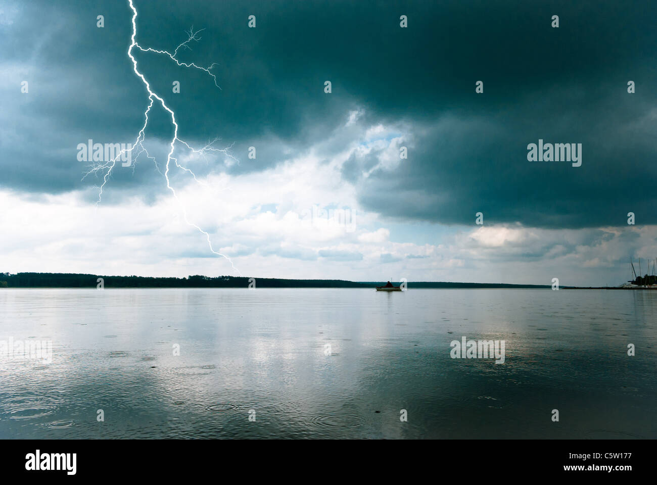 lighting behind the clouds on a warm evening, nature series Stock Photo ...