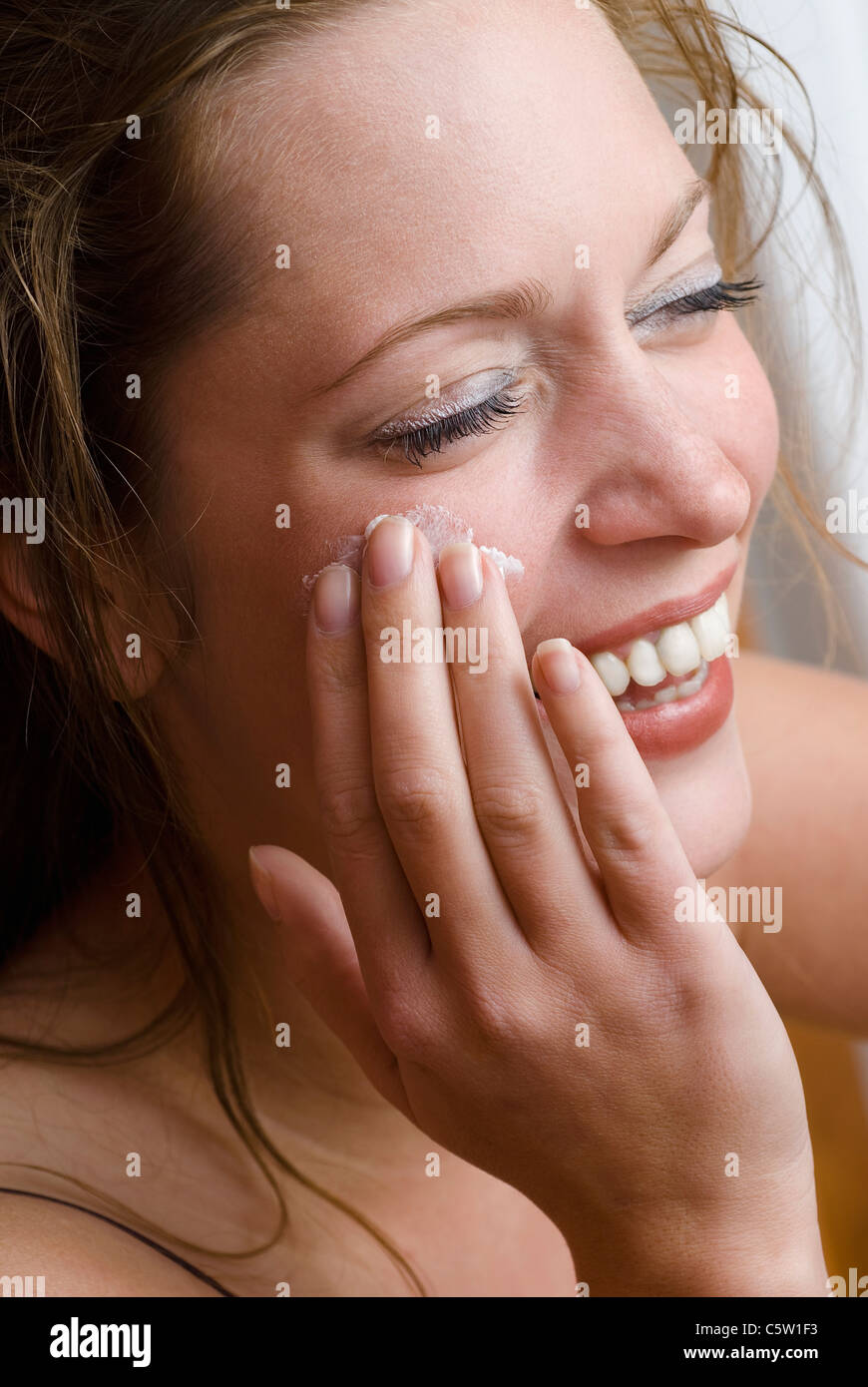 Young woman creaming hi-res stock photography and images - Alamy