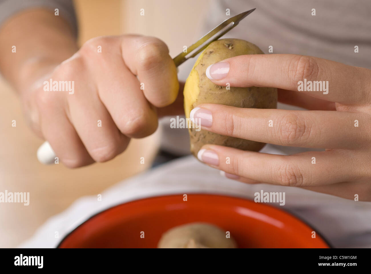 Person peeling potatoes, close-up Stock Photo - Alamy