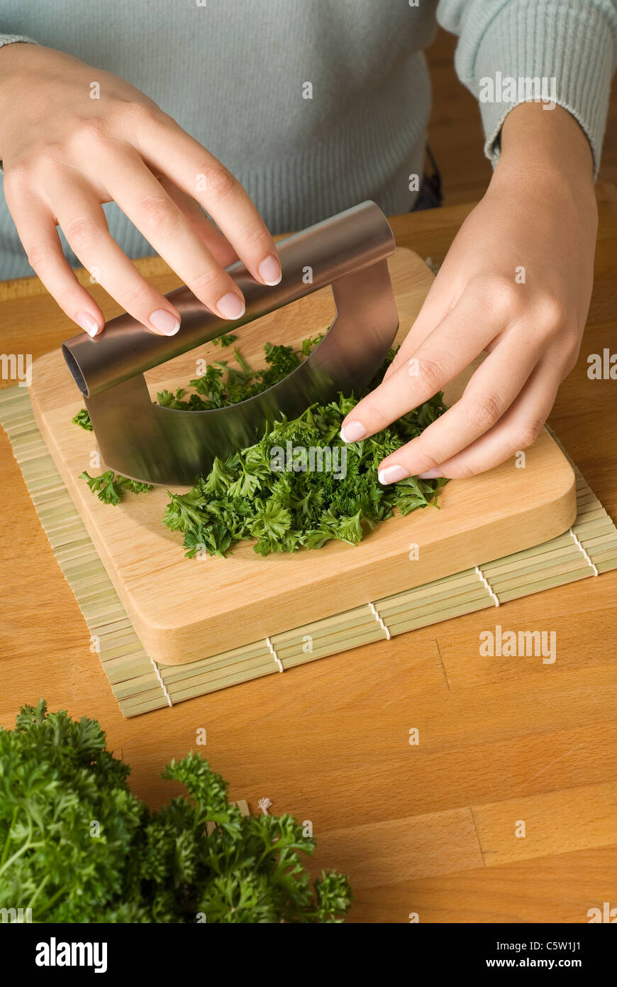 Person cutting parsley hi-res stock photography and images - Alamy