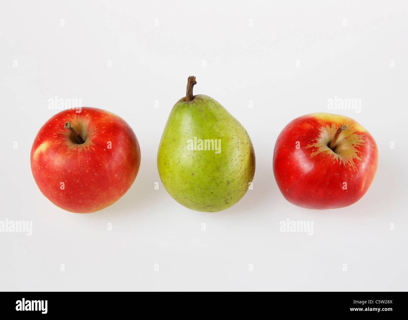 Apples and pear, elevated view Stock Photo - Alamy