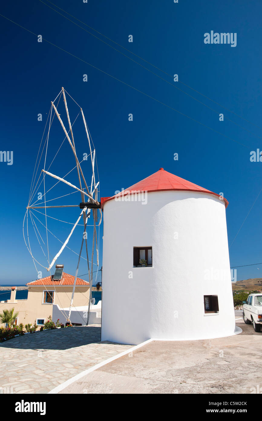 A traditional cloth sailed windmill converted into a house in Sigri, on ...