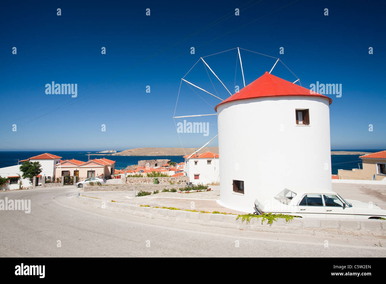 A traditional cloth sailed windmill converted into a house in Sigri, on ...