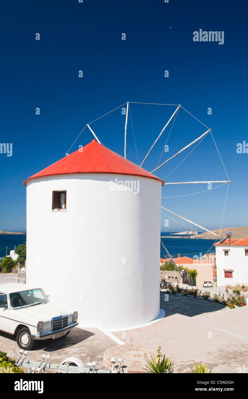 A traditional cloth sailed windmill converted into a house in Sigri, on ...
