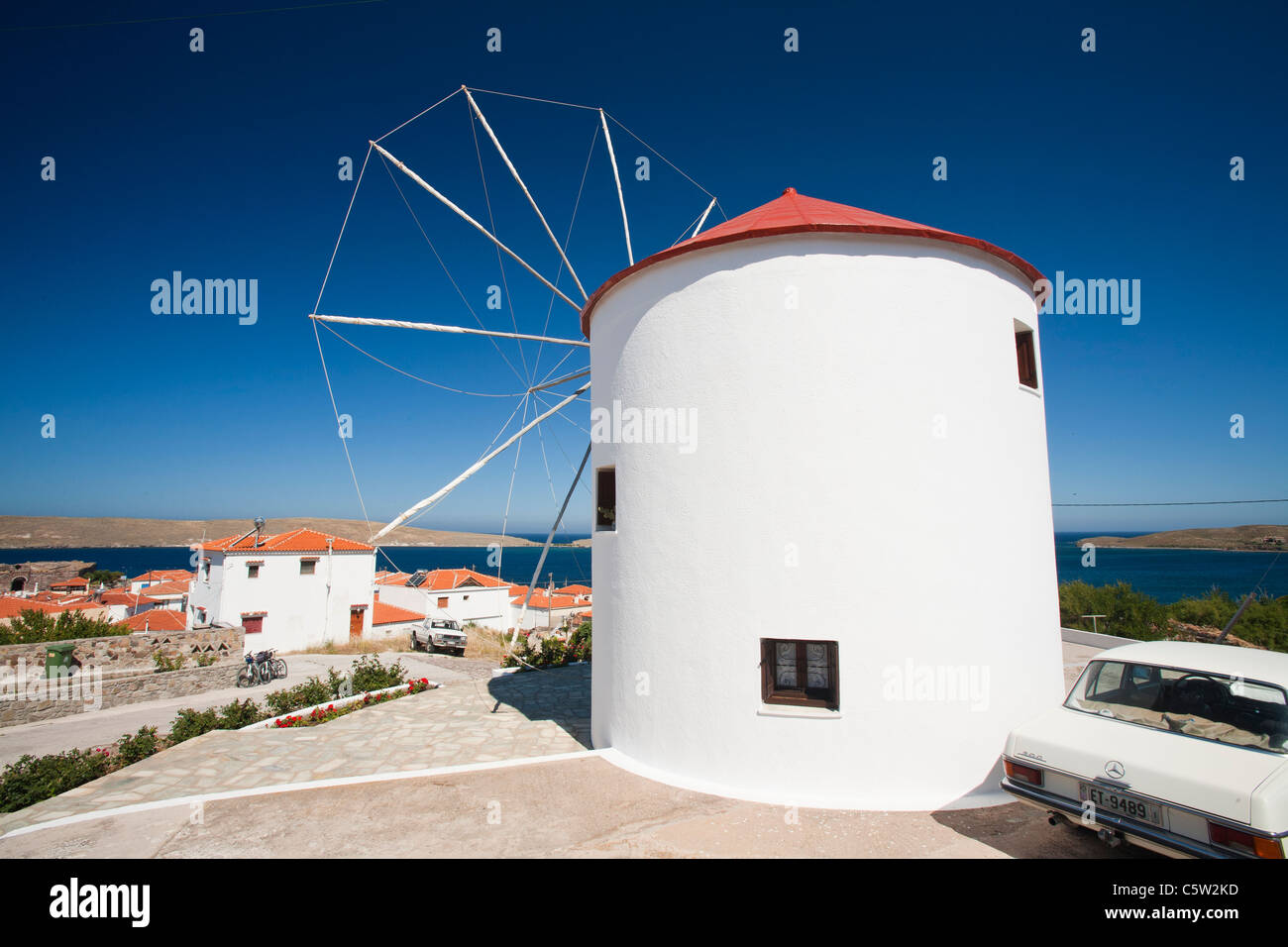 A traditional cloth sailed windmill converted into a house in Sigri, on ...