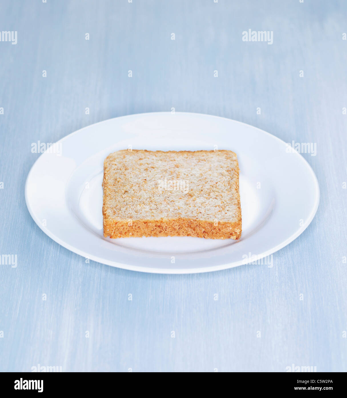 Slice of wholemeal toast on plate Stock Photo - Alamy
