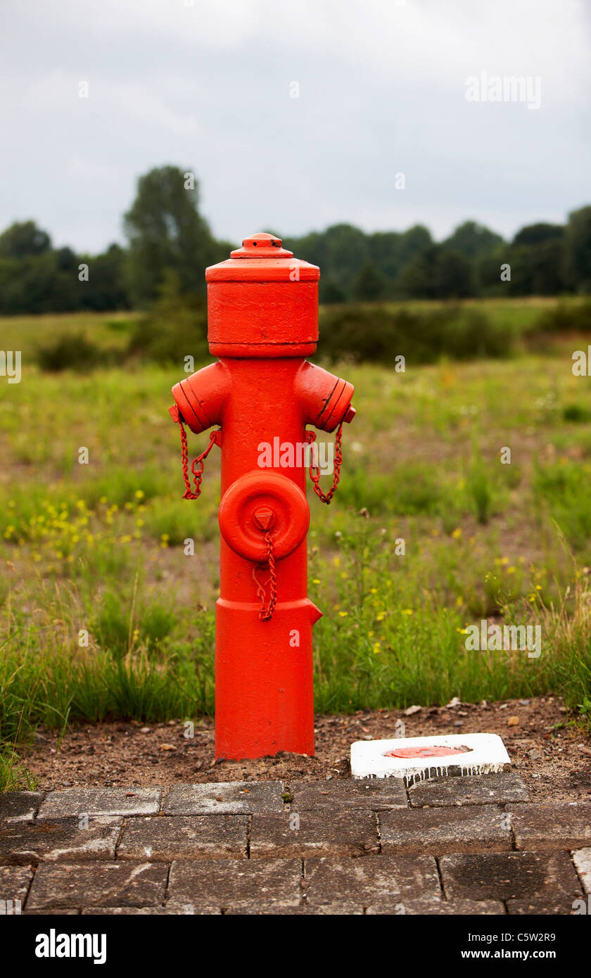 Red Hydrant in landscape Stock Photo - Alamy