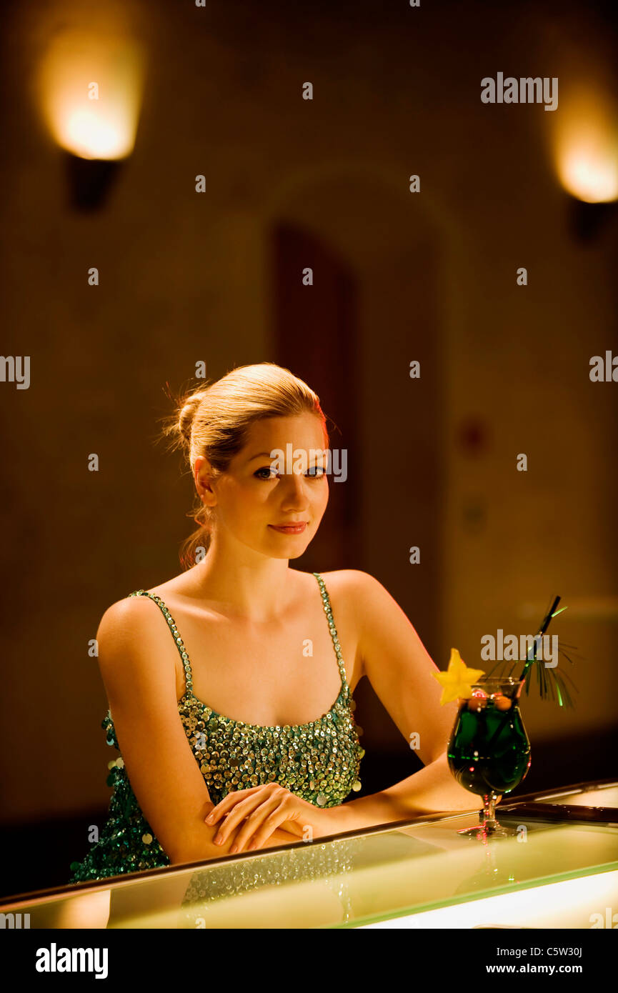 Young woman in bar, portrait Stock Photo - Alamy