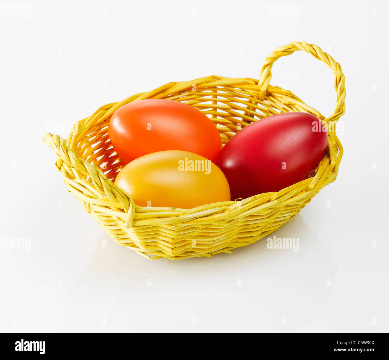 Colorful Easter eggs in basket Stock Photo - Alamy