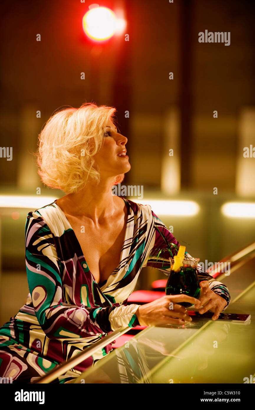 Young woman in bar, portrait Stock Photo - Alamy