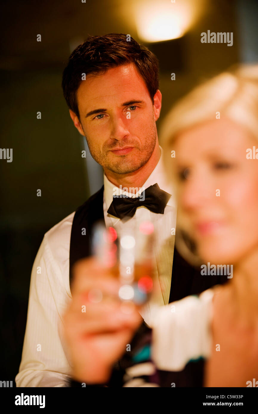 Blonde woman and barkeeper in bar Stock Photo - Alamy
