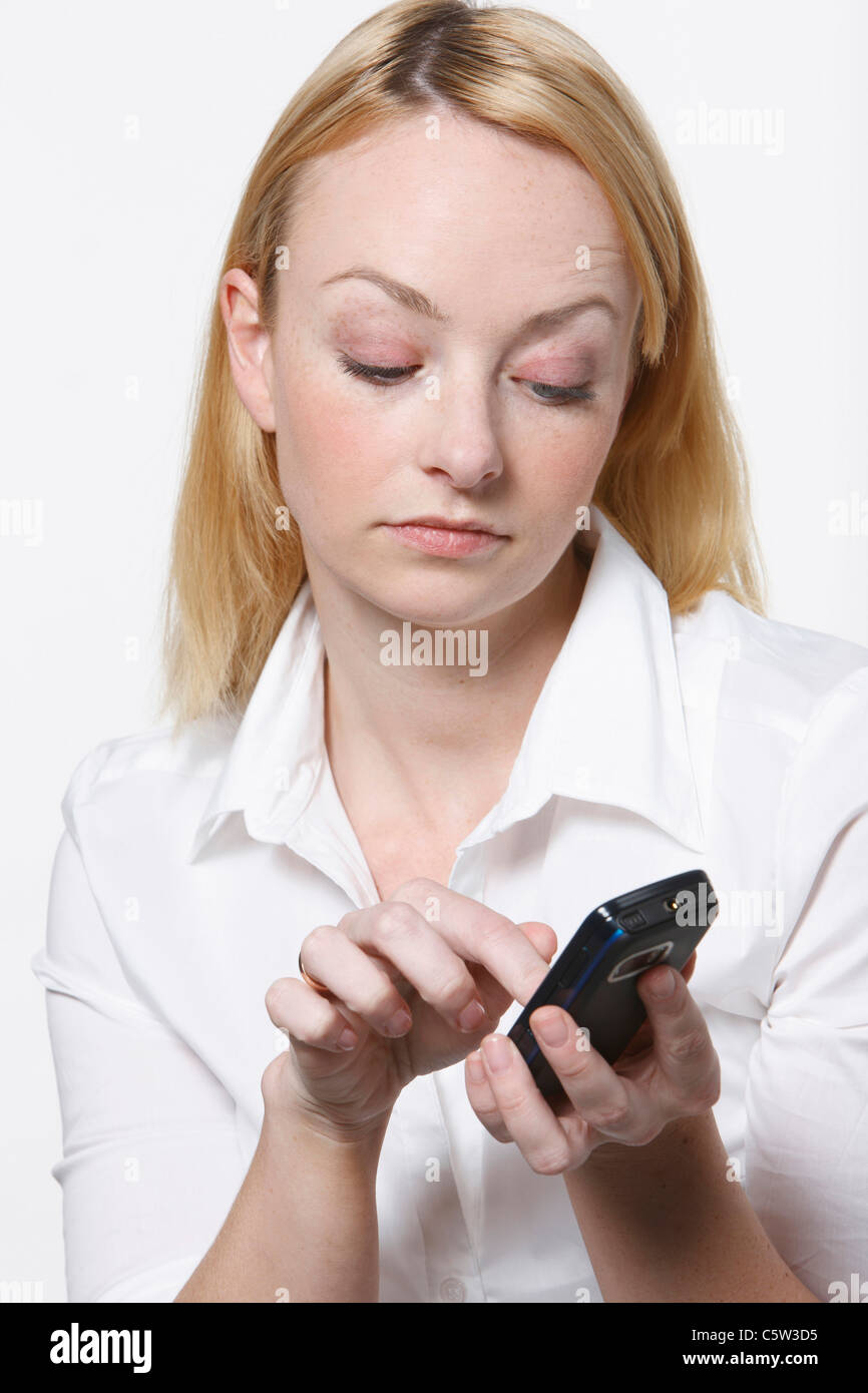 Young woman using mobile phone, portrait Stock Photo - Alamy