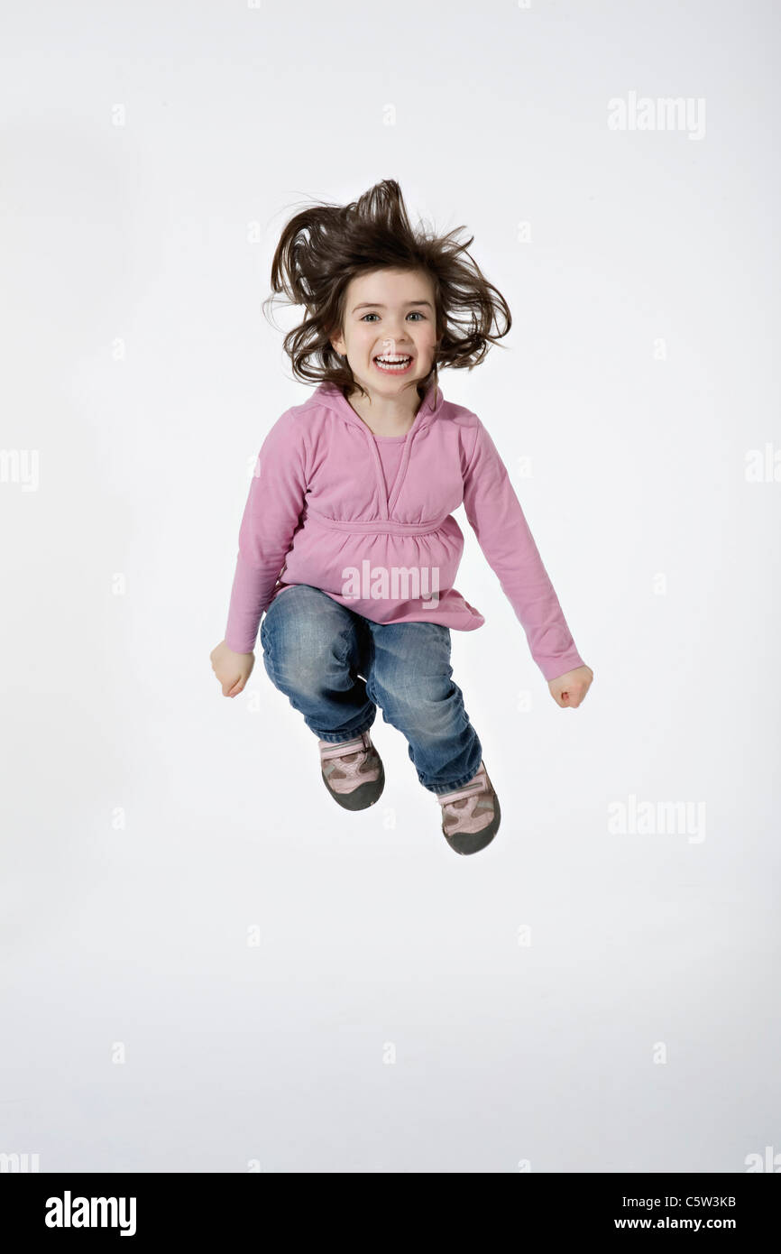 Girl (4-5) jumping, portrait Stock Photo - Alamy