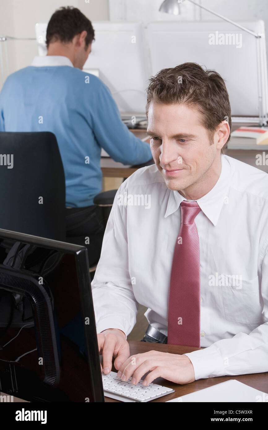 Germany, Munich, two businessmen in office Stock Photo - Alamy