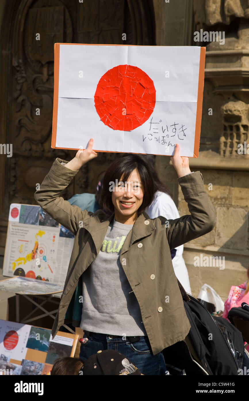 Japanese lady holding a Japanese flag raising funds for the tsunami ...
