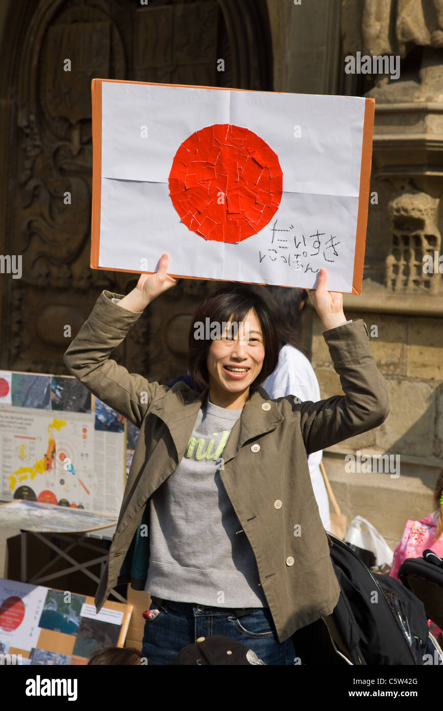 Japanese lady holding a Japanese flag raising funds for the tsunami ...
