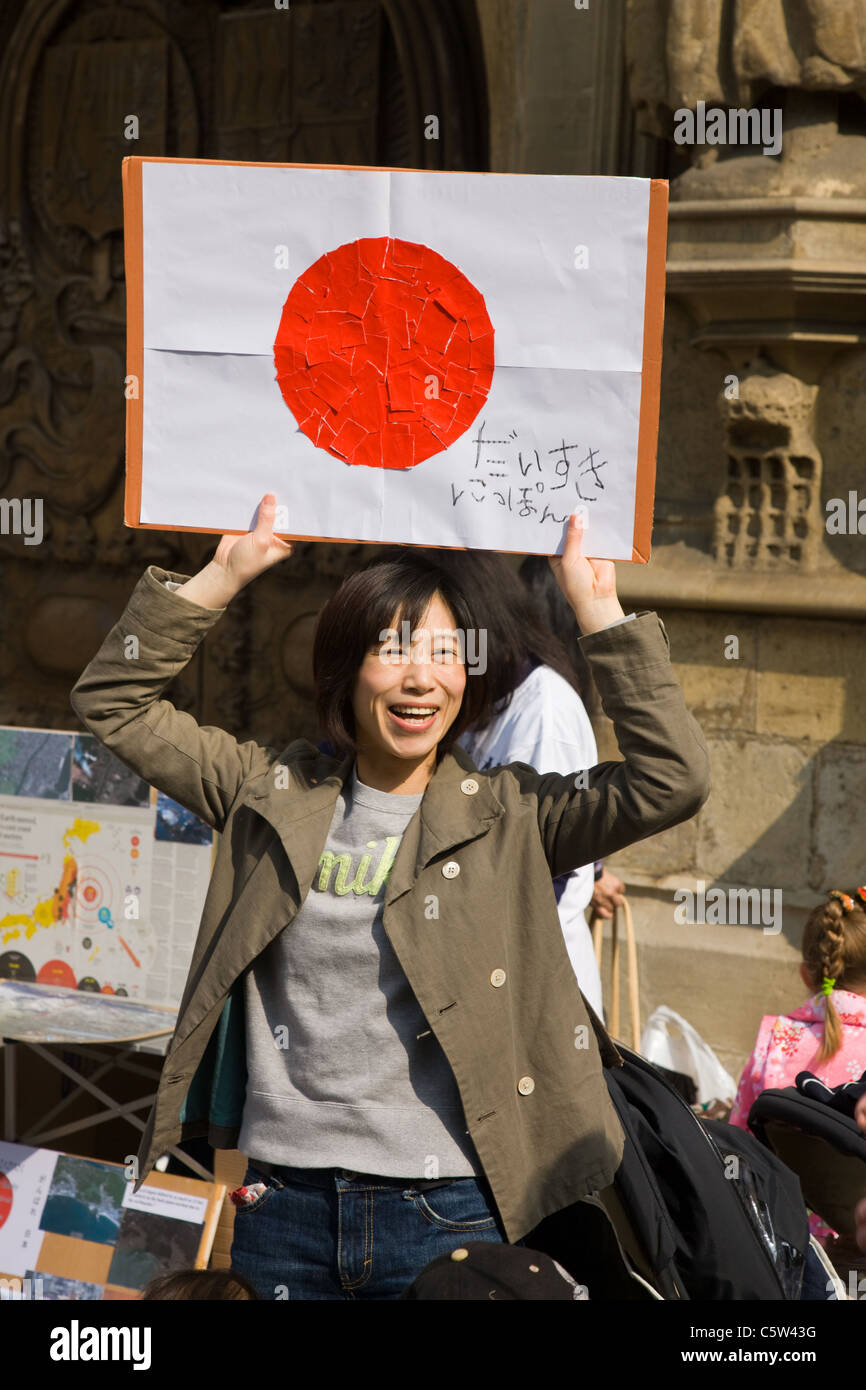 Japanese lady holding a Japanese flag raising funds for the tsunami ...