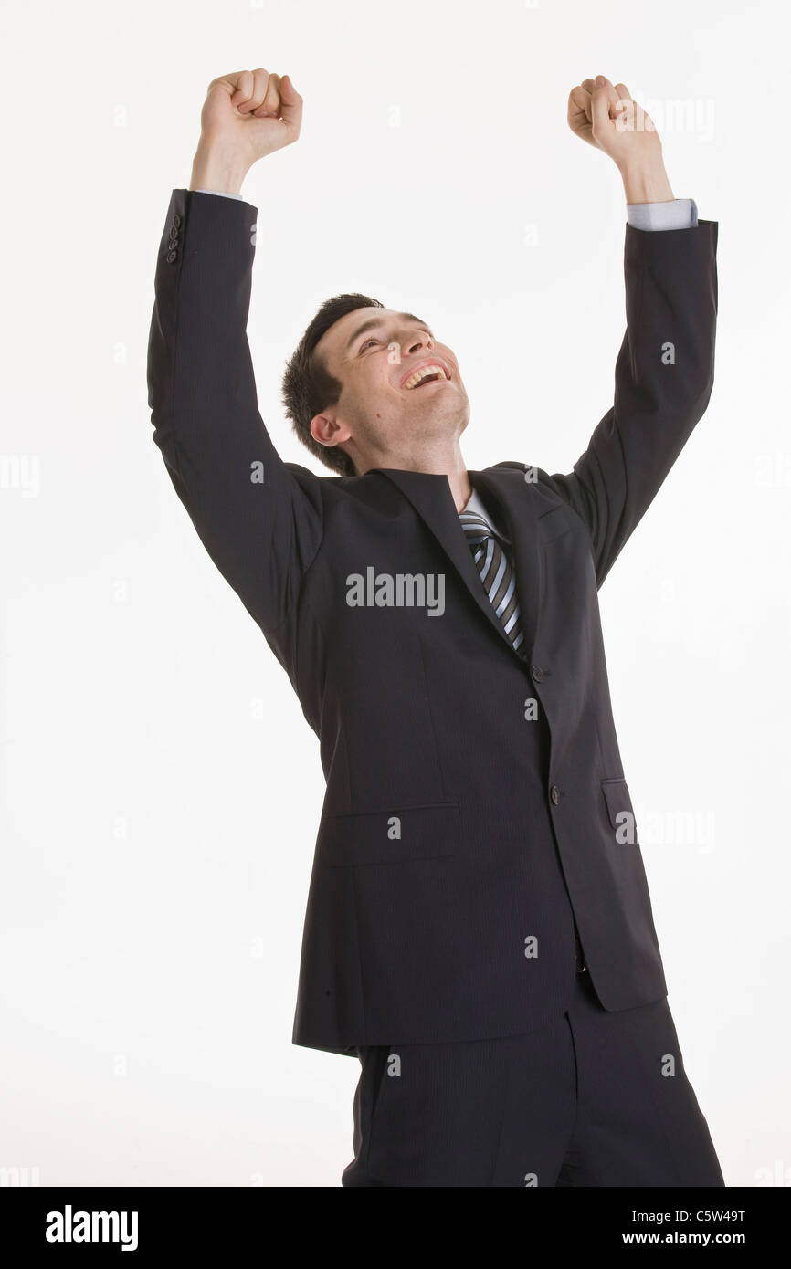 Businessman cheering, hands up, portrait Stock Photo - Alamy