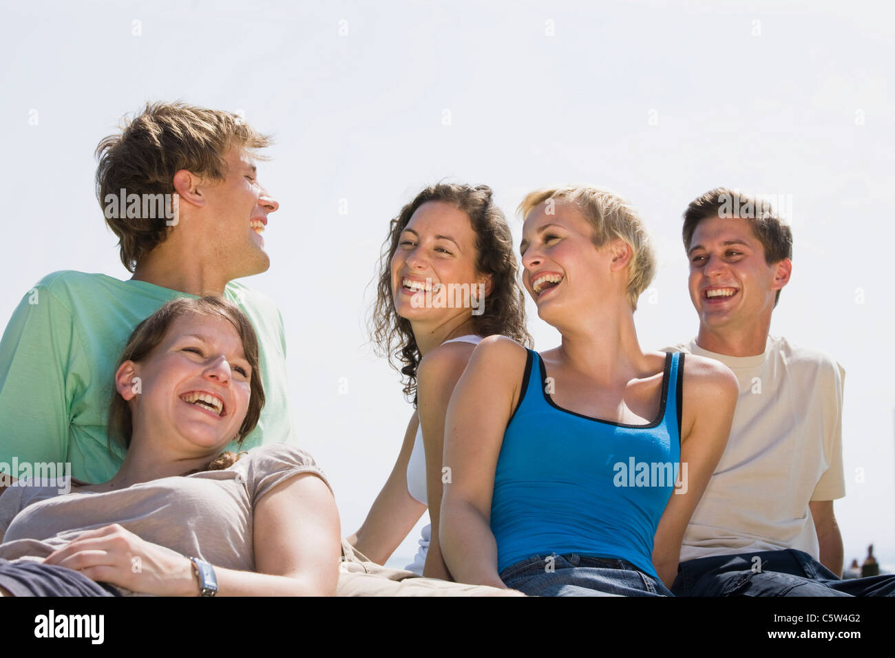 Germany, Bavaria, Young people, side by side, laughing, portrait, close ...