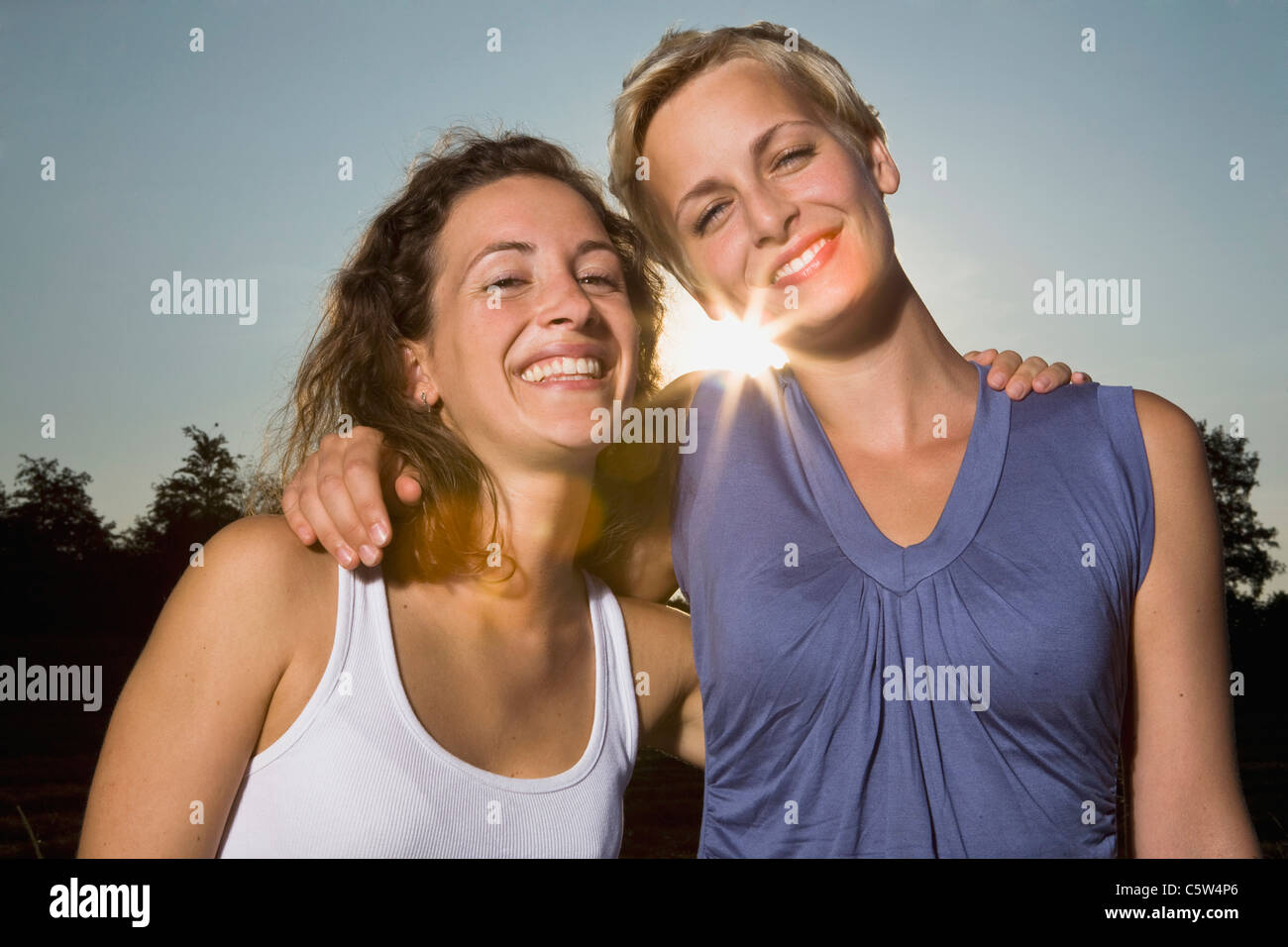 Germany, Bavaria, Two young women, smiling, portrait, close-up Stock ...