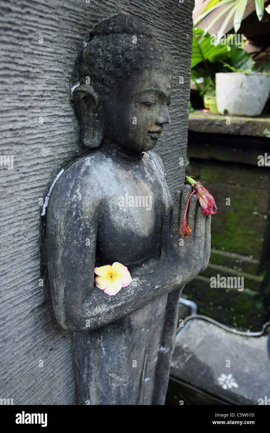Buddha garden statue flower Stock Photo - Alamy
