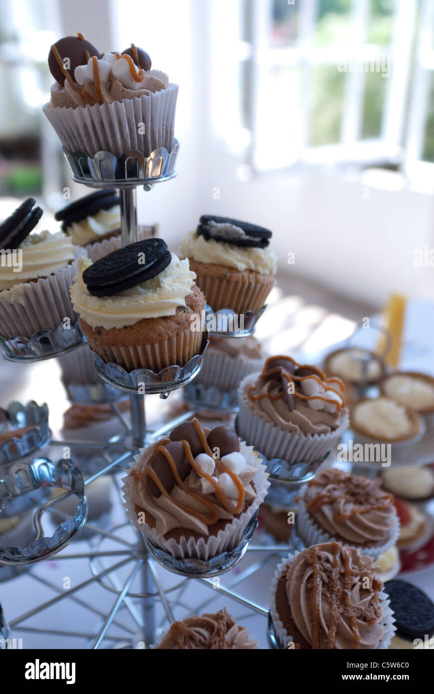 A cake stand full of yummy treats Stock Photo - Alamy