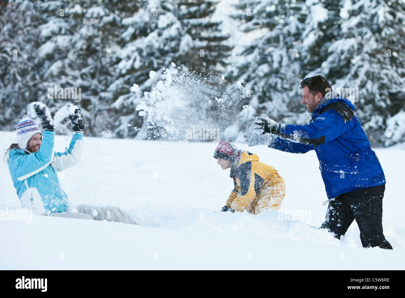 Germany, Bavaria, Family having snowball fight Stock Photo - Alamy