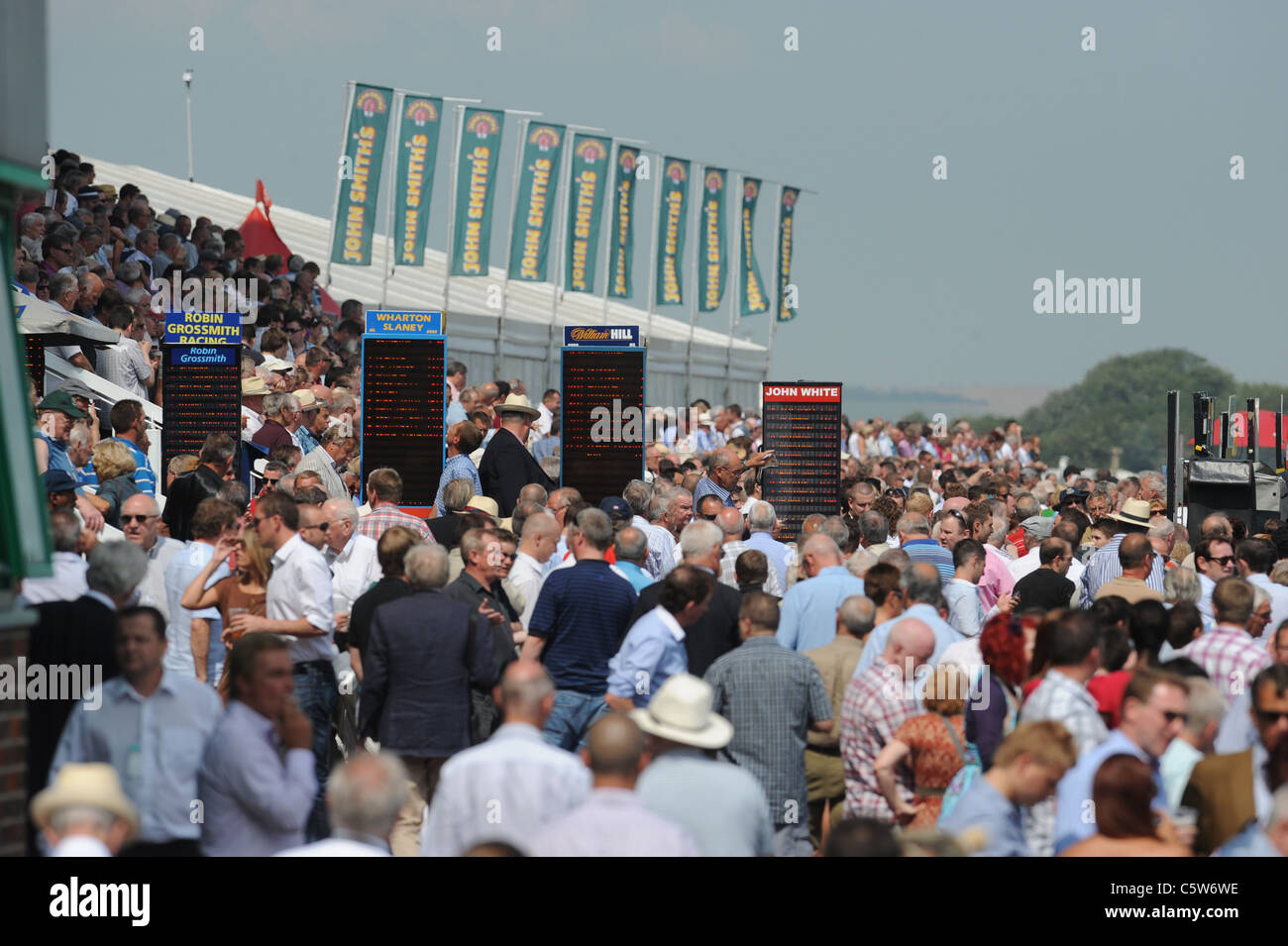 A packed crowd on the first day of the Brighton Races Festival Sussex ...