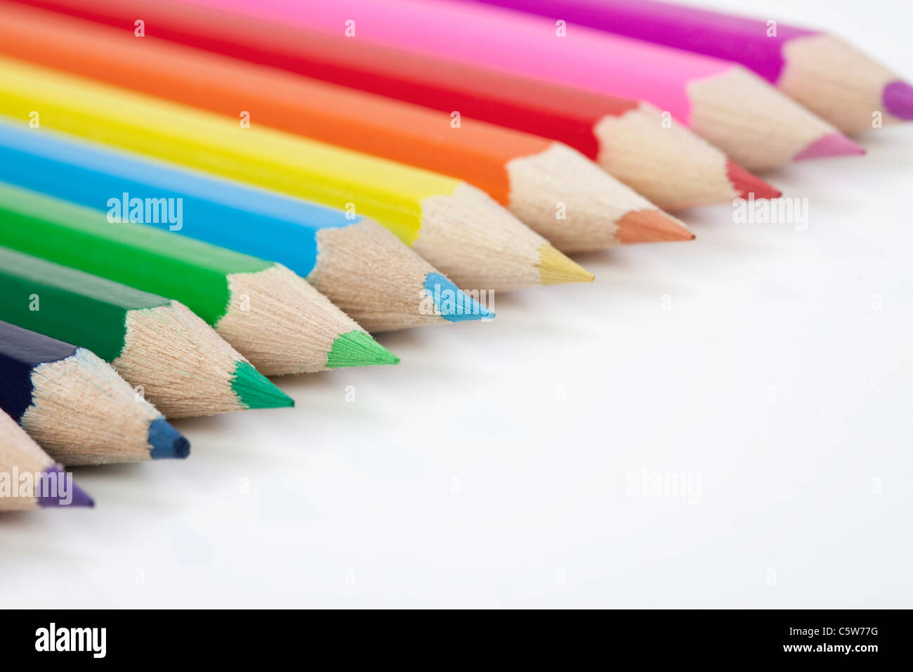 Colored pencils in a row Stock Photo - Alamy