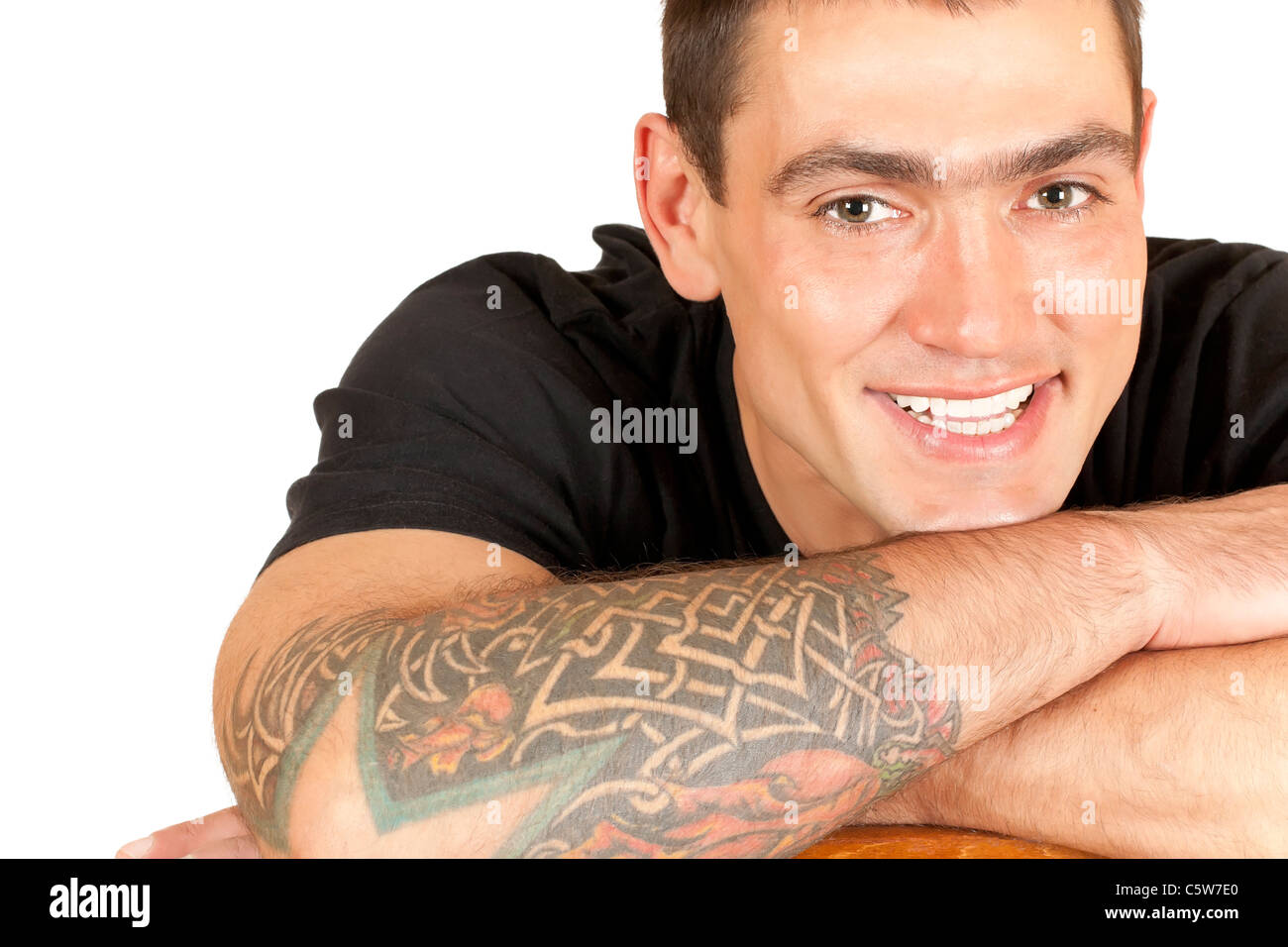 portrait of a young man with tattoos on his hand isolated on white ...