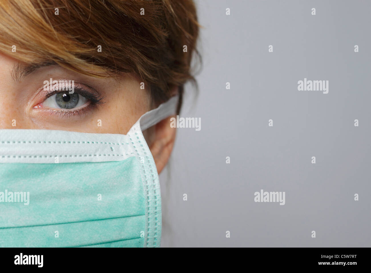 Female doctor wearing surgical mask, portrait, close-up Stock Photo - Alamy
